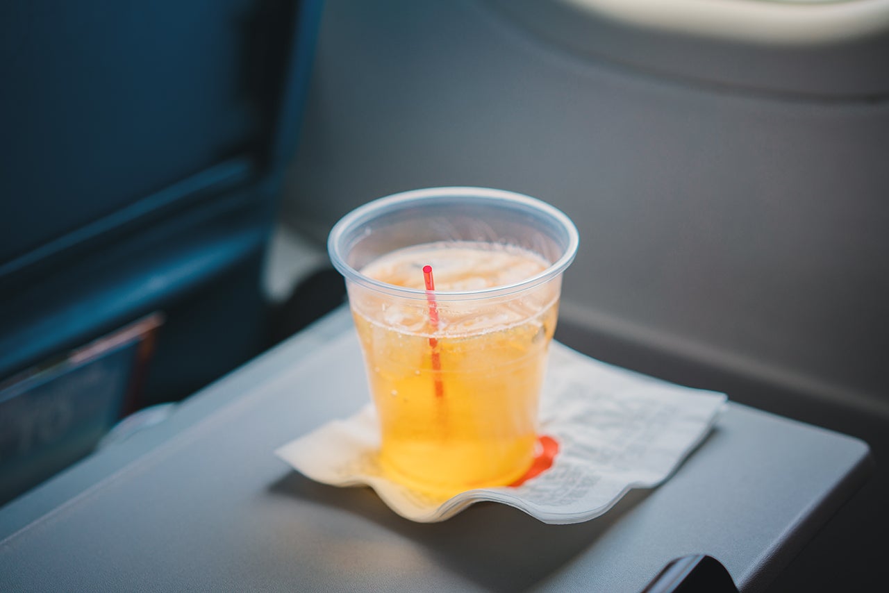 How to Drink for Free in Economy - The Points Guy