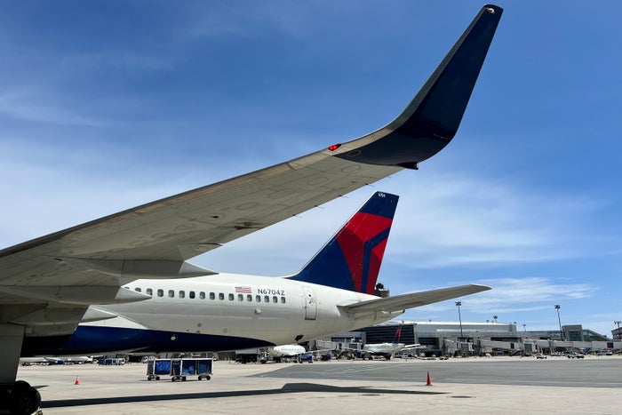 Memorial Day weekend crowds hit airports as Delta cancels hundreds more ...